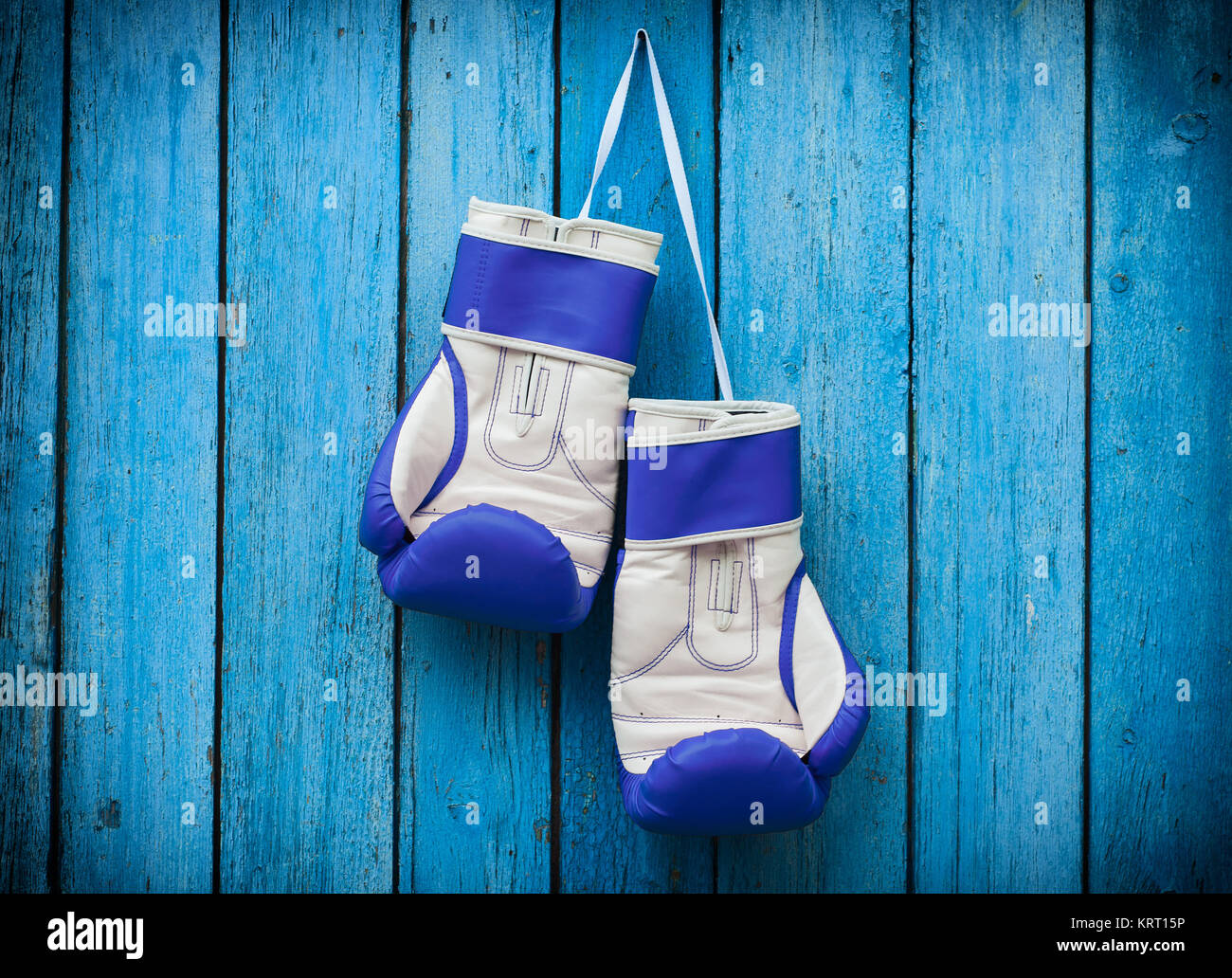 Blue Leather Hanging Boxing Gloves High Resolution Stock Photography ...