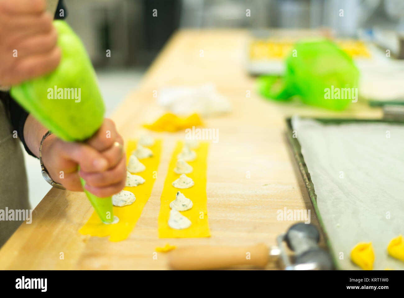 Chef pastry baker woman preparing , cooking and baking stuffed pasta ...