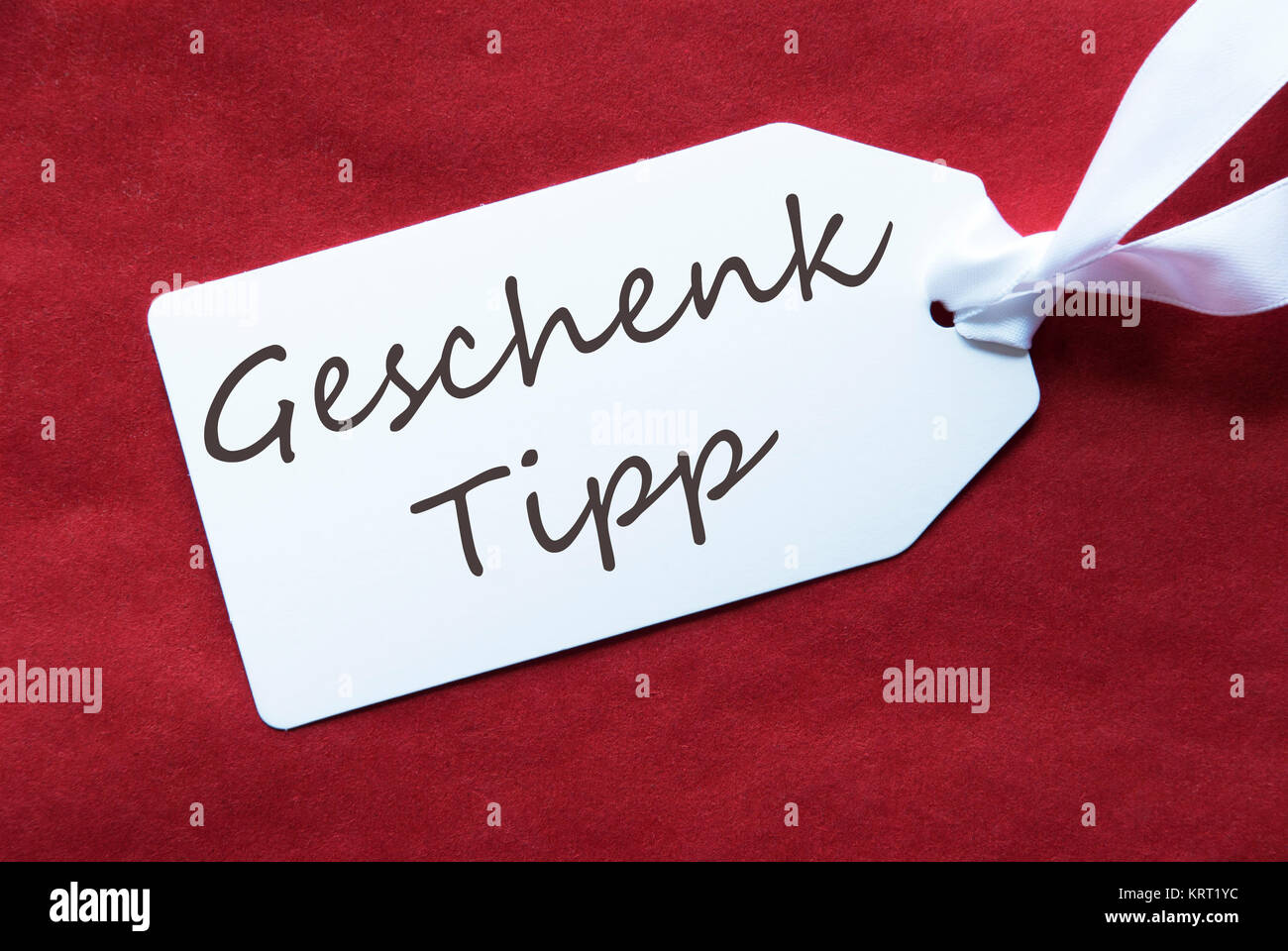 German Text Geschenk Tipp Means Gift Tip. One White Label On A Red ...