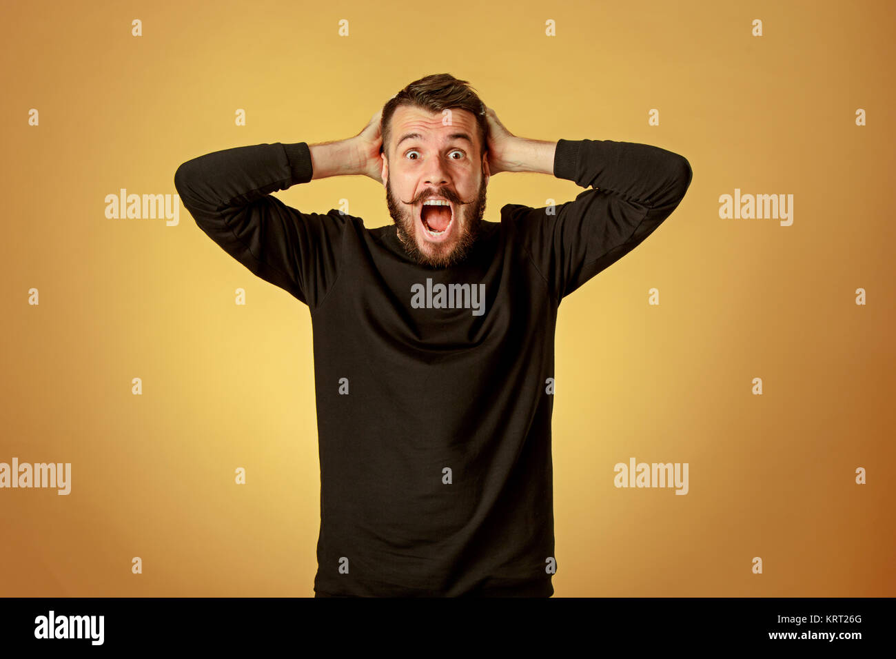 Portrait of young man with shocked facial expression Stock Photo - Alamy
