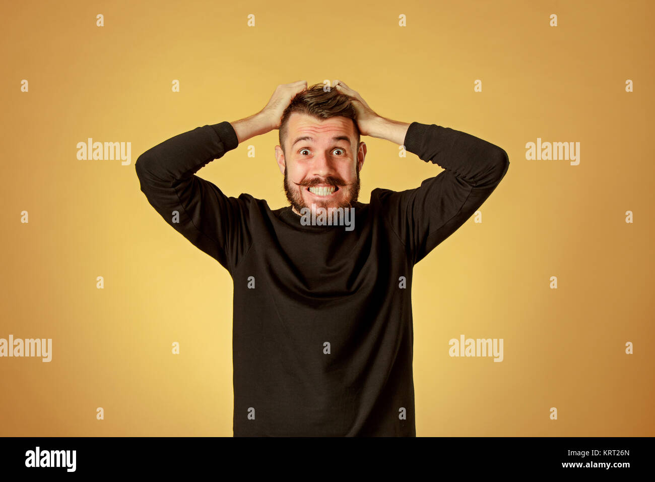 Portrait of young man with shocked facial expression Stock Photo - Alamy