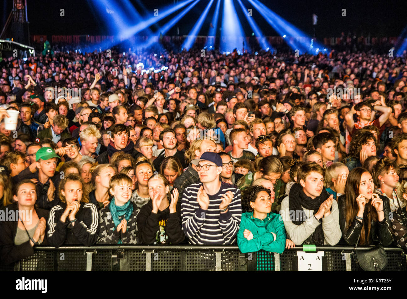 The area in front of the Orange Stage is packed with festival goers and ...