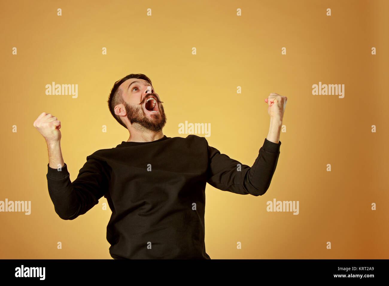 The young man looking at camera Stock Photo - Alamy