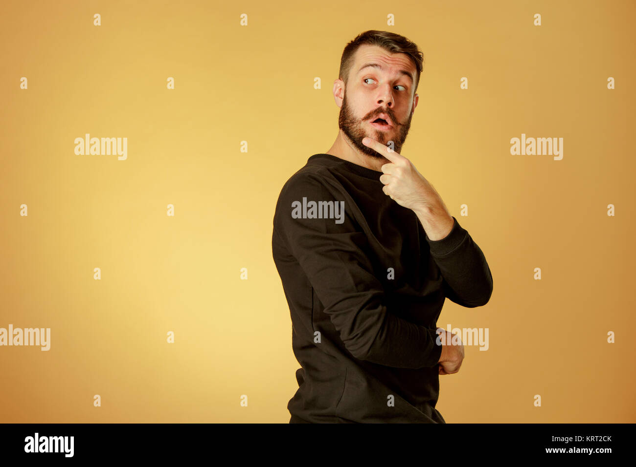 Portrait of young man with shocked facial expression Stock Photo - Alamy