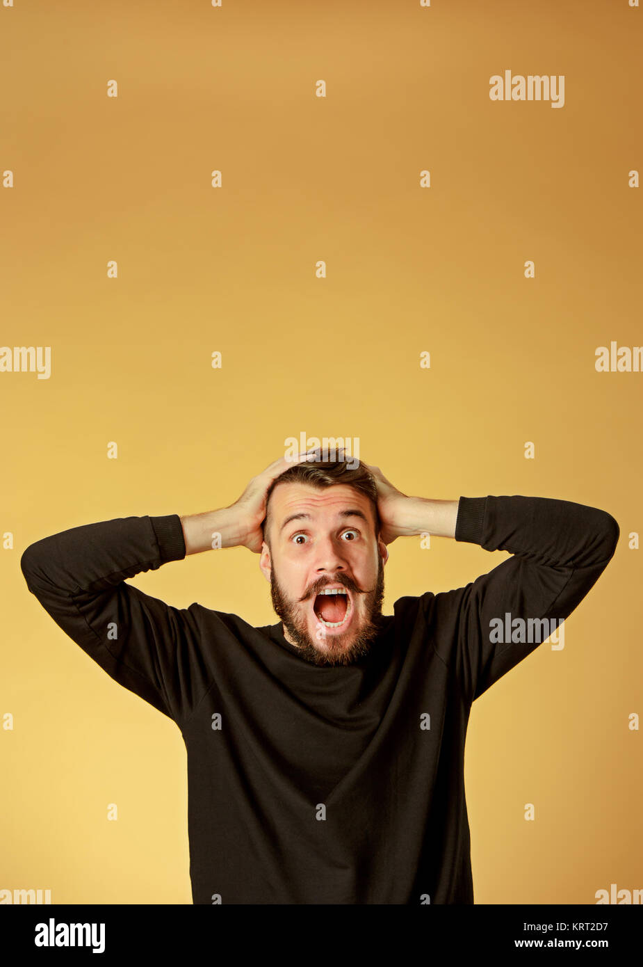 Portrait of young man with shocked facial expression Stock Photo - Alamy