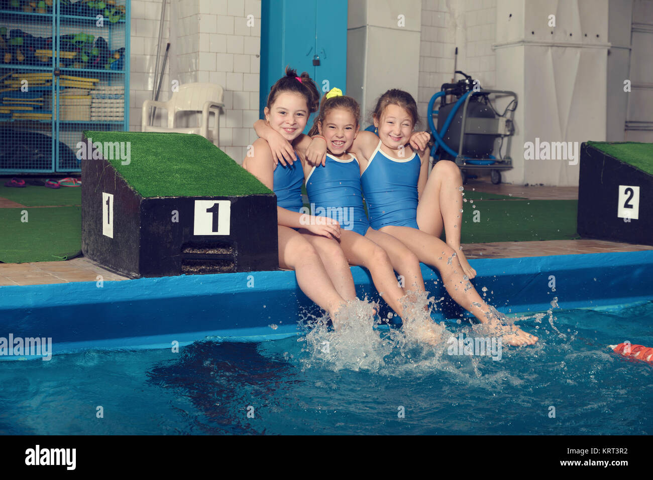 Three Friends School Girls Pool Splash Stock Photo - Alamy