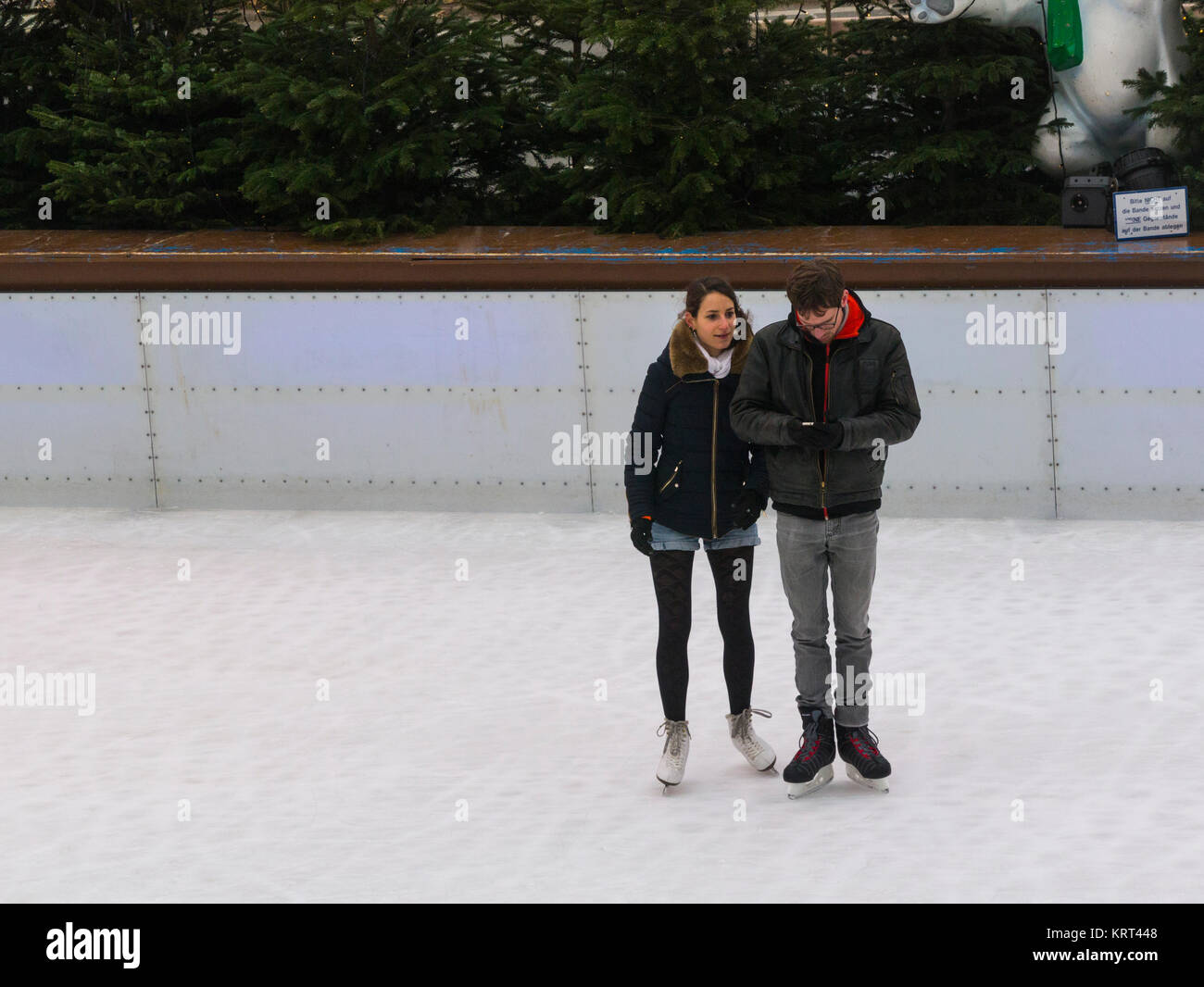 Young Couple standing on ice skates Münchener EisZauber Munich Ice ...