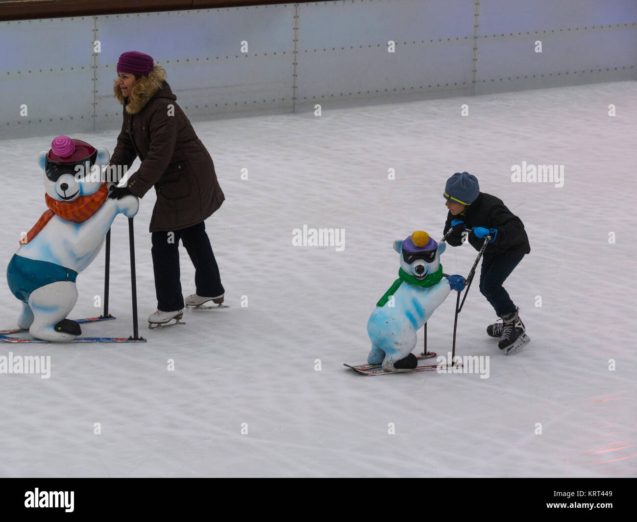 Mother and child in Münchener EisZauber Munich Ice Magic ice rink ...