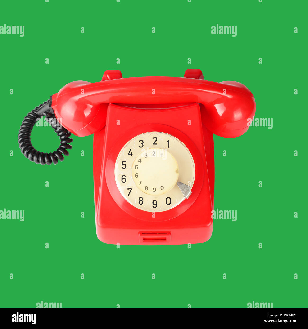Beautiful red vintage phone on a green background Stock Photo - Alamy