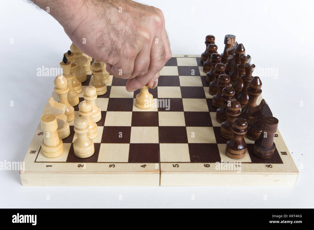 Chess. The man's hand makes the first move E2-E4 Stock Photo - Alamy