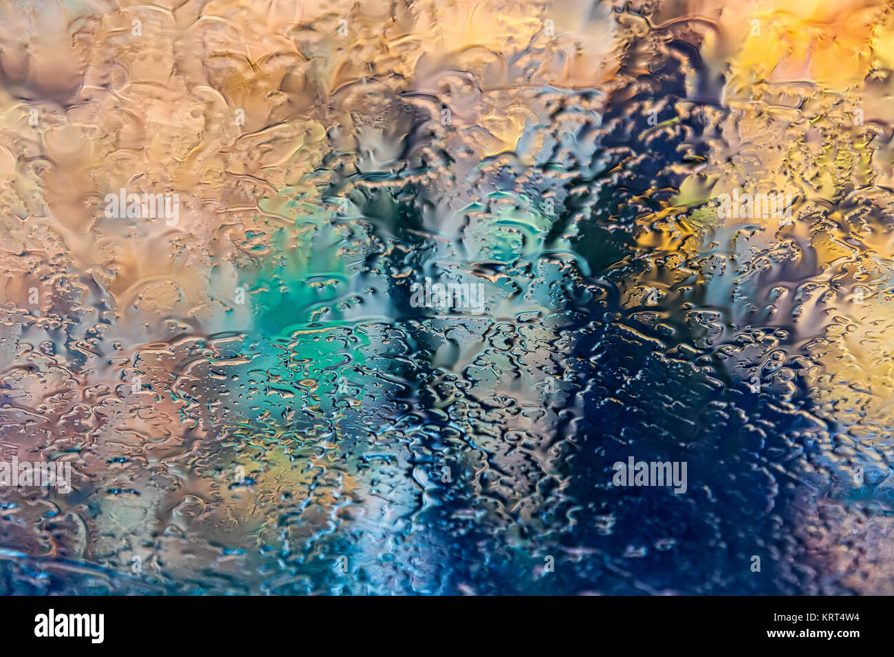rain in the park glass wet surface with reflection, rain drops on the ...