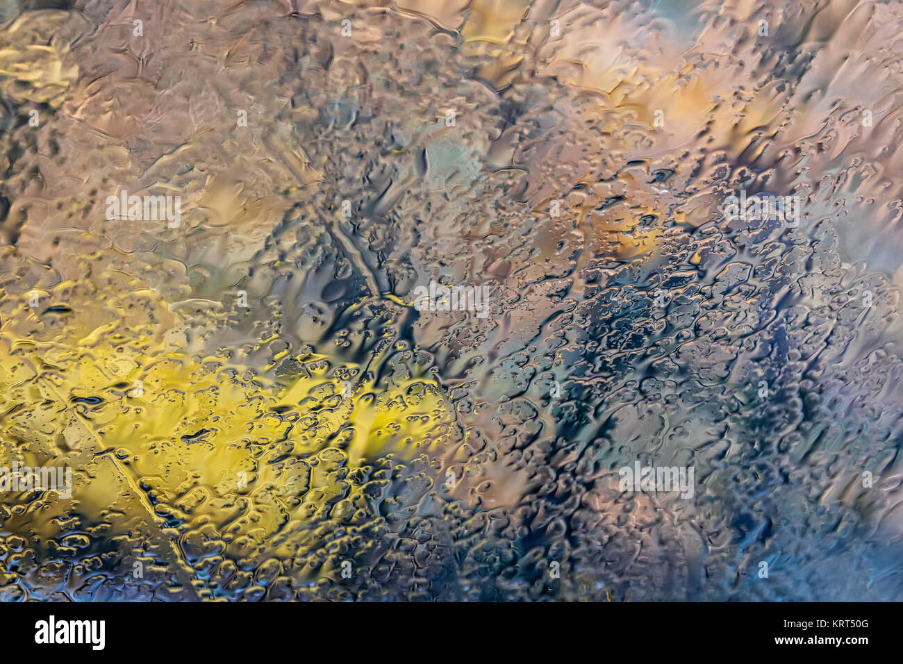 rain in the park glass wet surface with reflection, rain drops on the ...