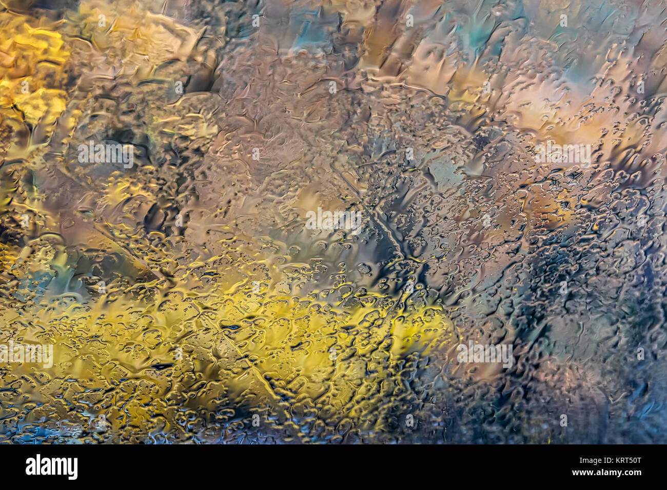 rain in the park glass wet surface with reflection, rain drops on the ...