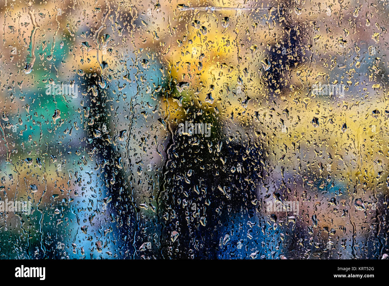 rain in the park glass wet surface with reflection, rain drops on the ...