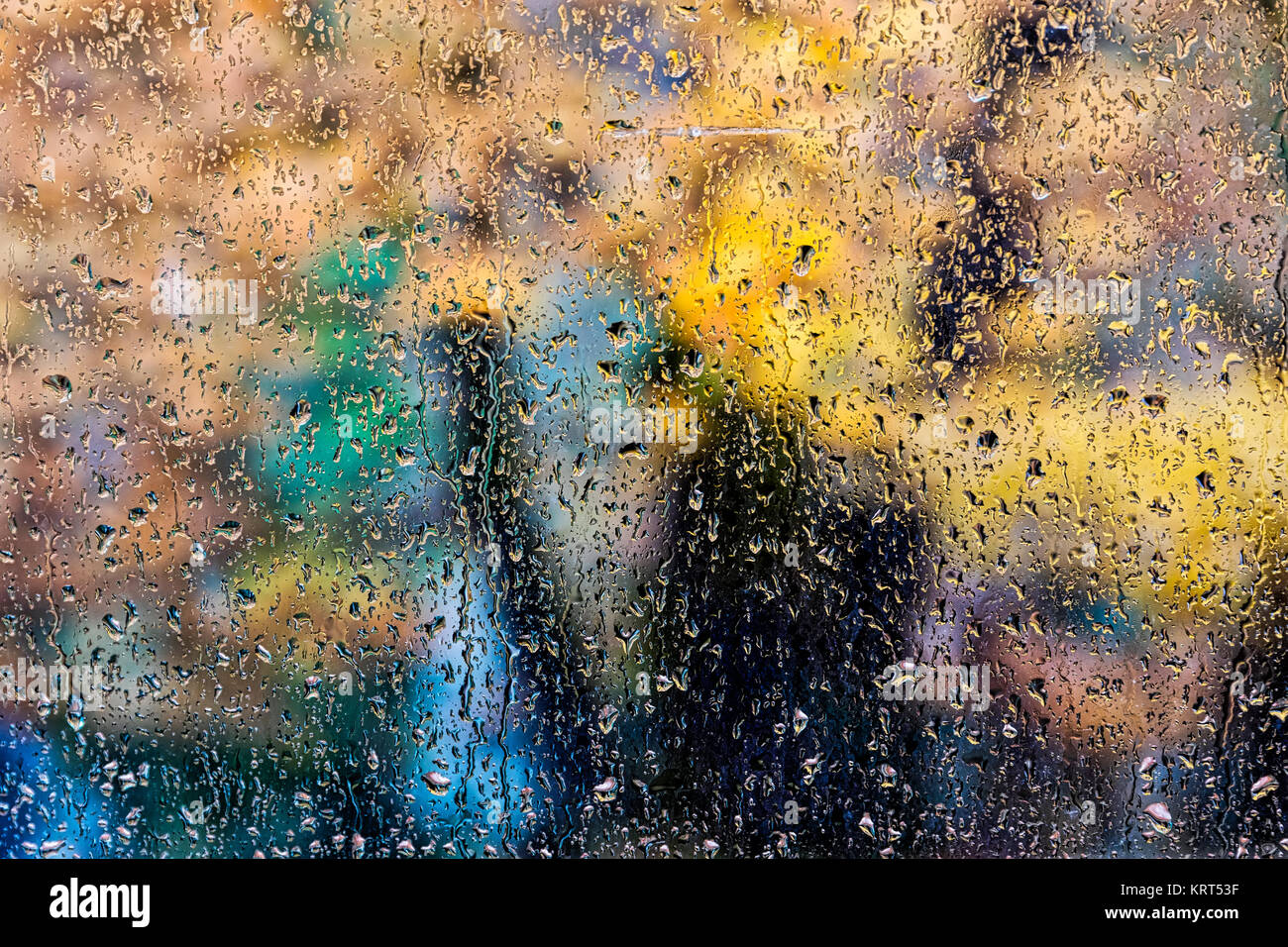rain in the park glass wet surface with reflection, rain drops on the ...