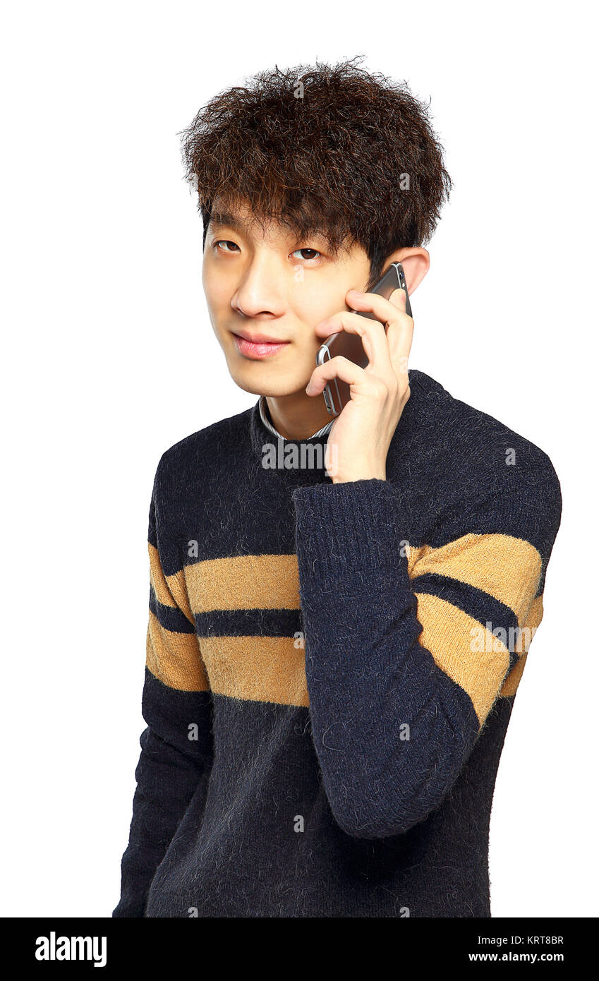 Happy young man talking on mobilephone Stock Photo - Alamy