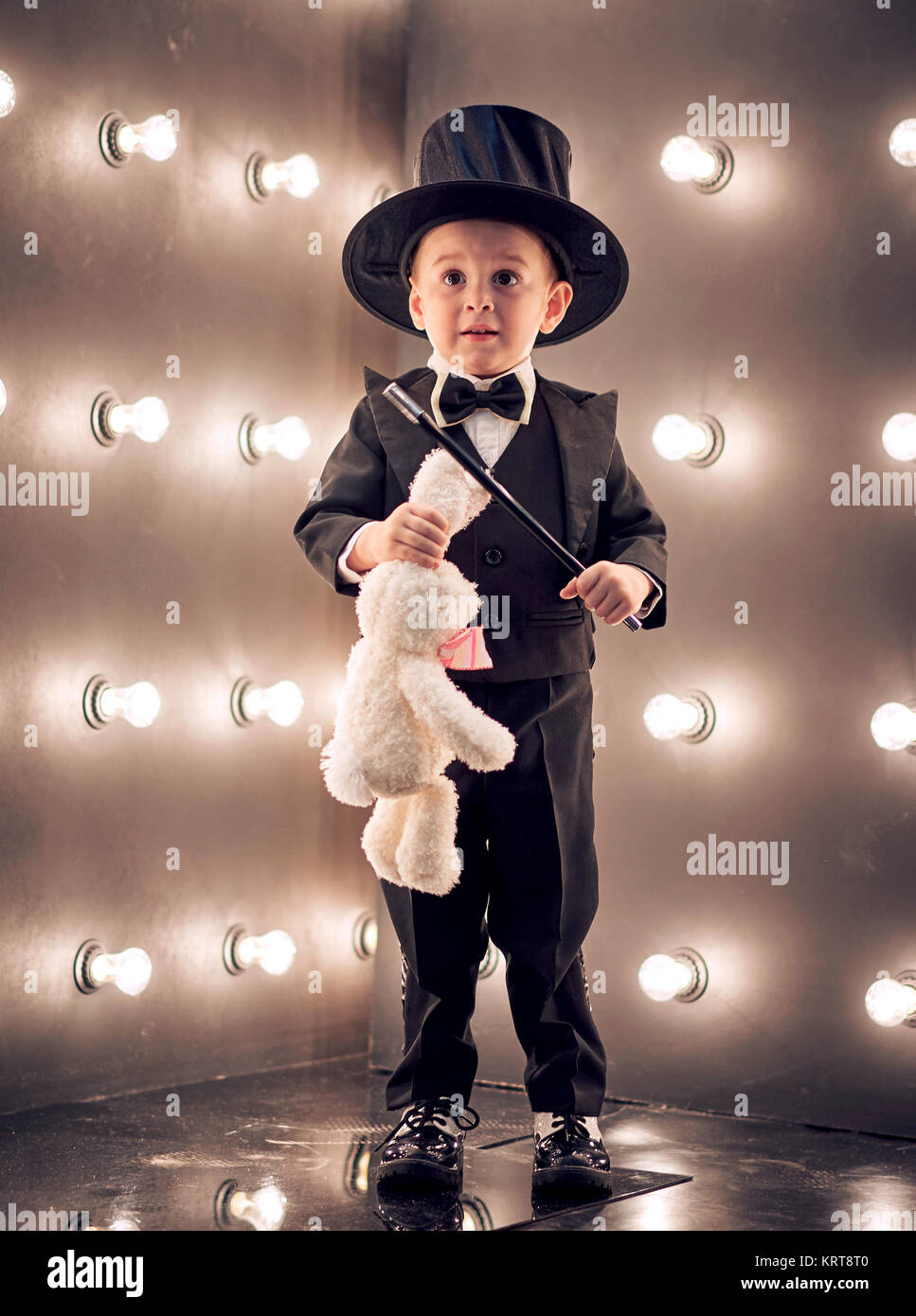 child magician with magic wand and hat Stock Photo - Alamy