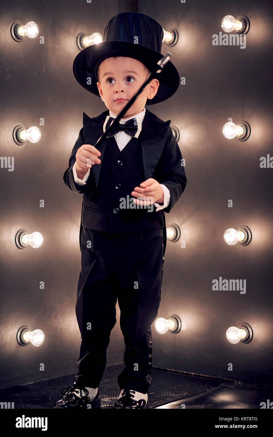 child magician with magic wand and hat Stock Photo - Alamy