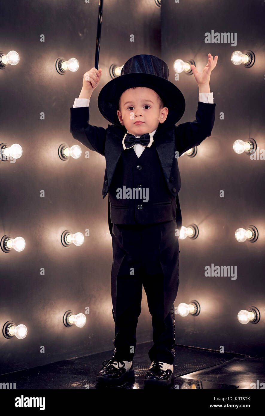 child magician with magic wand and hat Stock Photo - Alamy
