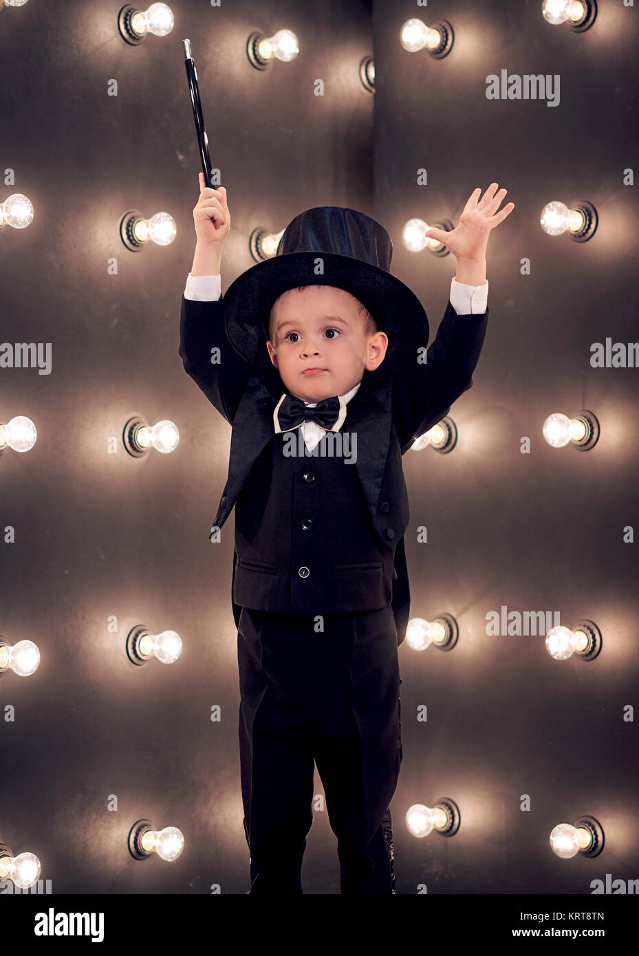 child magician with magic wand and hat Stock Photo - Alamy