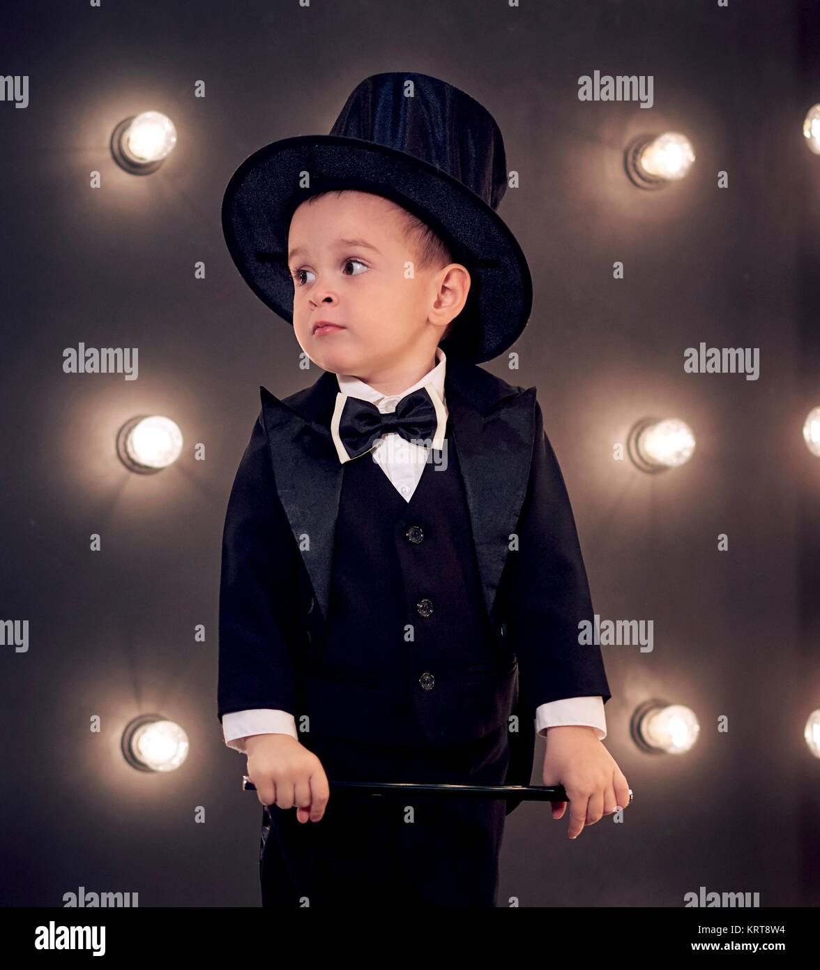 child magician with magic wand and hat Stock Photo - Alamy