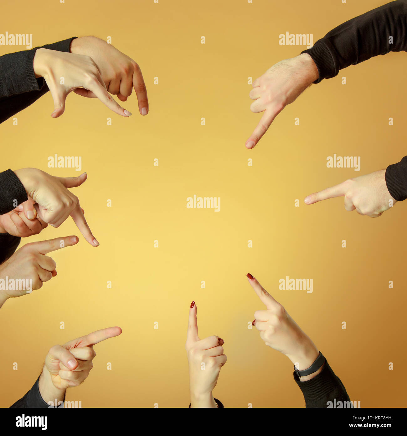 Many hands pointing ahead or out on orange background Stock Photo - Alamy