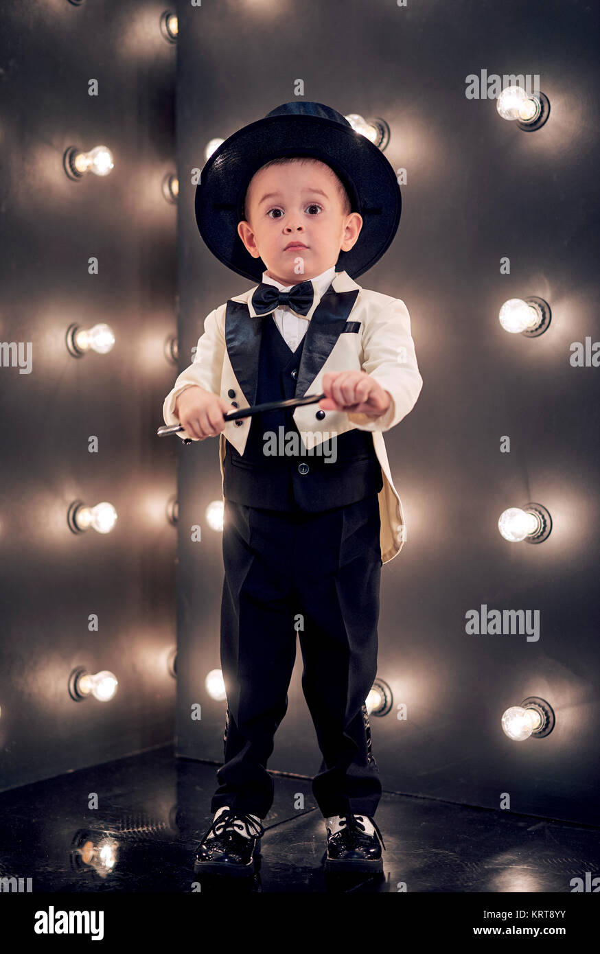 child magician with magic wand and hat Stock Photo - Alamy