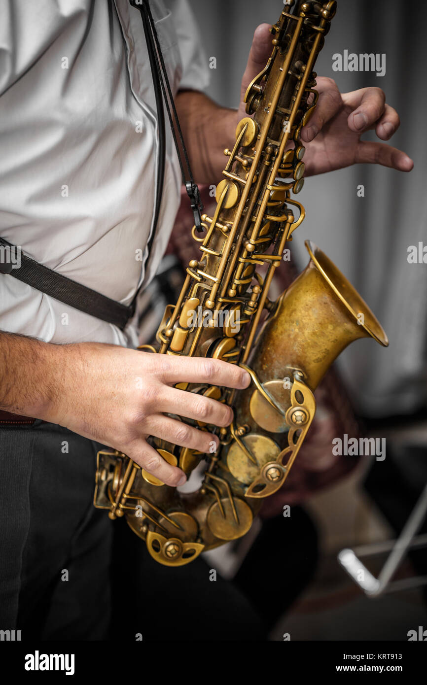 Musician playing the saxophone Stock Photo - Alamy