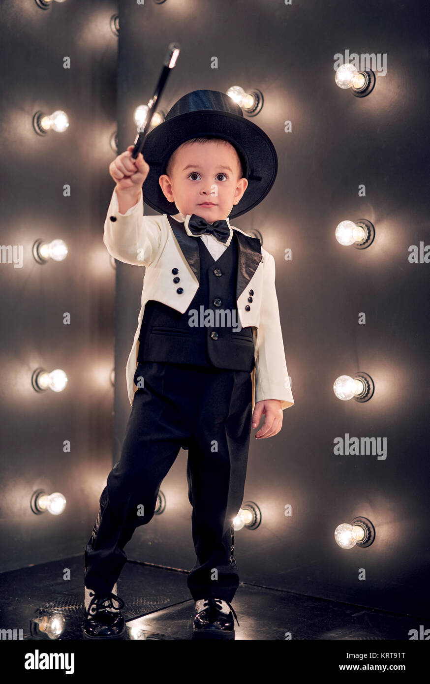 child magician with magic wand and hat Stock Photo - Alamy