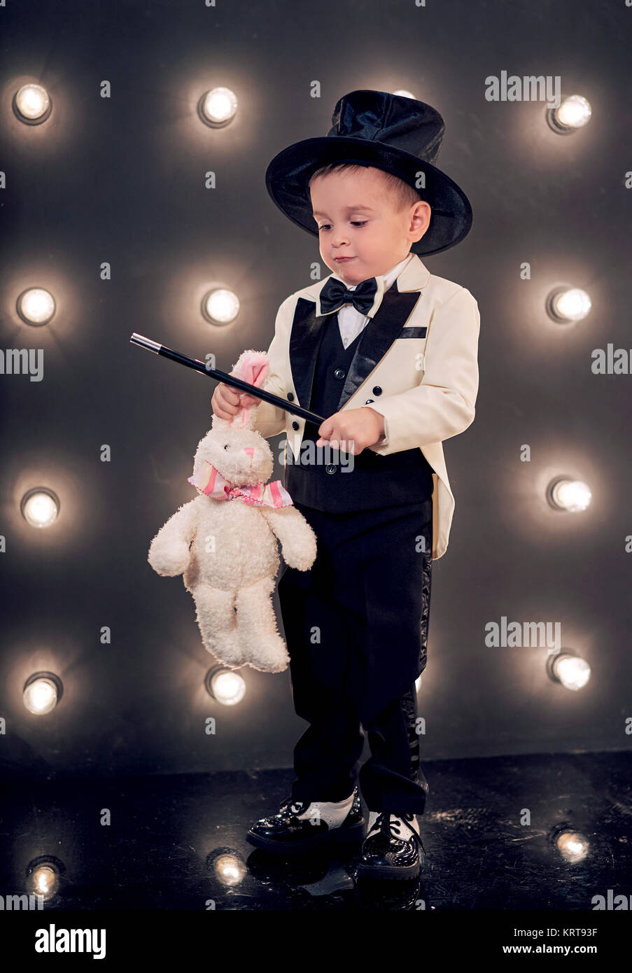 child magician with magic wand and hat Stock Photo - Alamy