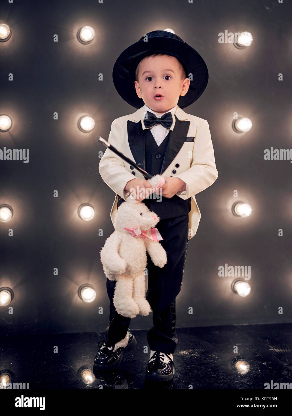 child magician with magic wand and hat Stock Photo - Alamy