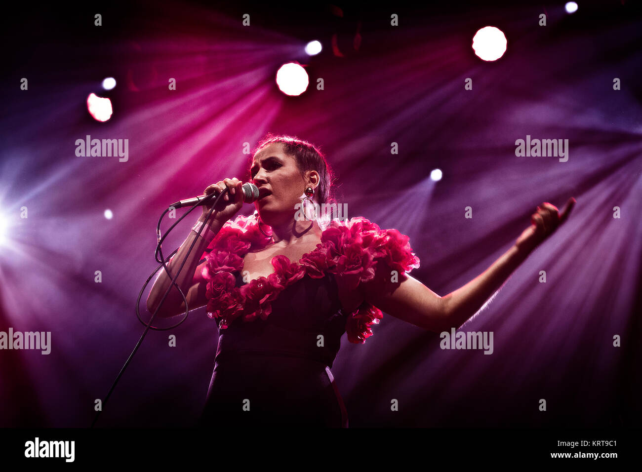 Singer and songwriter Coco O wears a flower-decorated dress at the ...