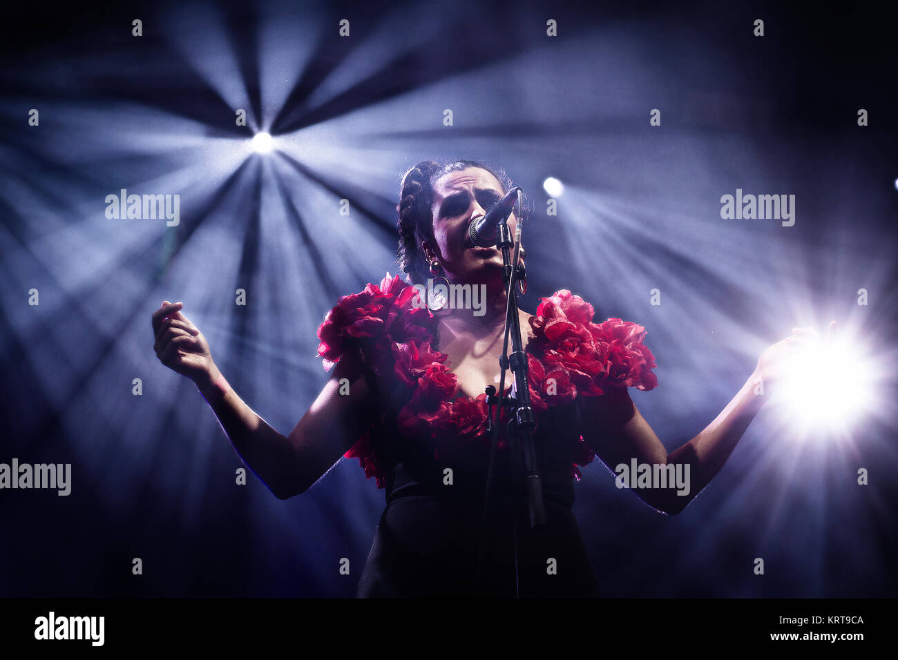 Singer and songwriter Coco O wears a flower-decorated dress at the ...