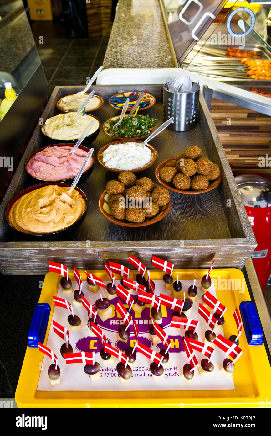 Delicious humus, dips and falafels are lined up at the local shawarma ...