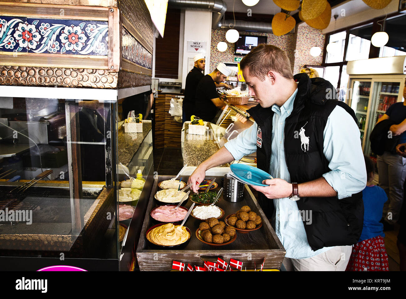 Delicious humus, dips and falafels are lined up at the local shawarma ...
