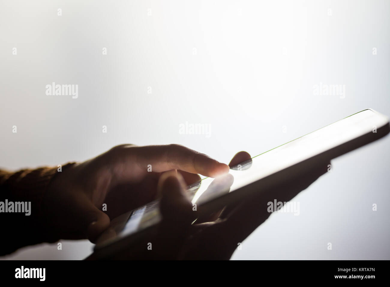 Person using a tablet Stock Photo - Alamy