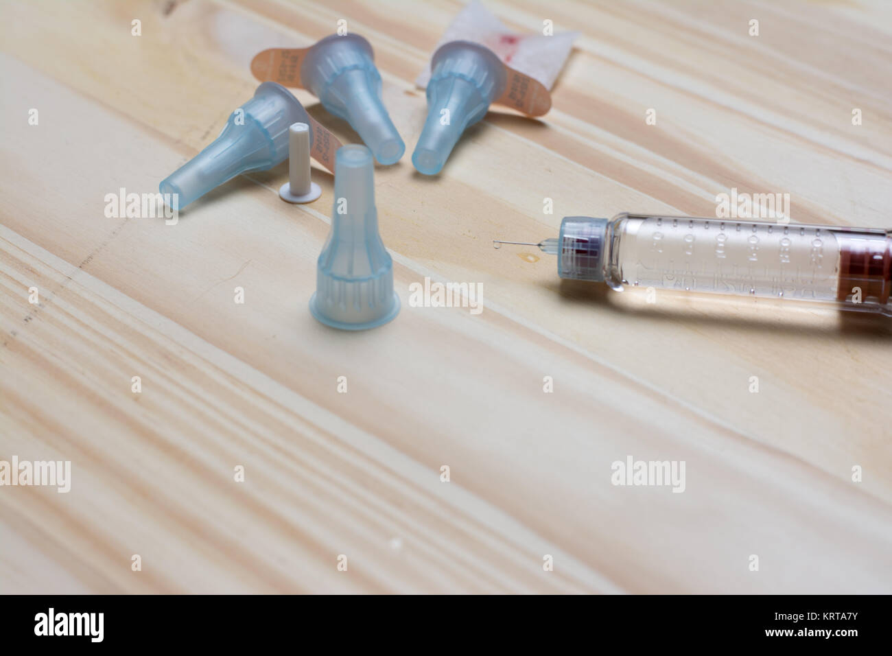 diabetic insulin pen with needles and wood background Stock Photo - Alamy
