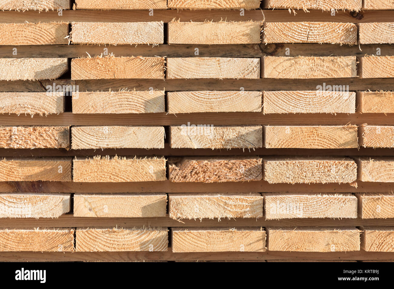 Stacked lumber background Stock Photo - Alamy