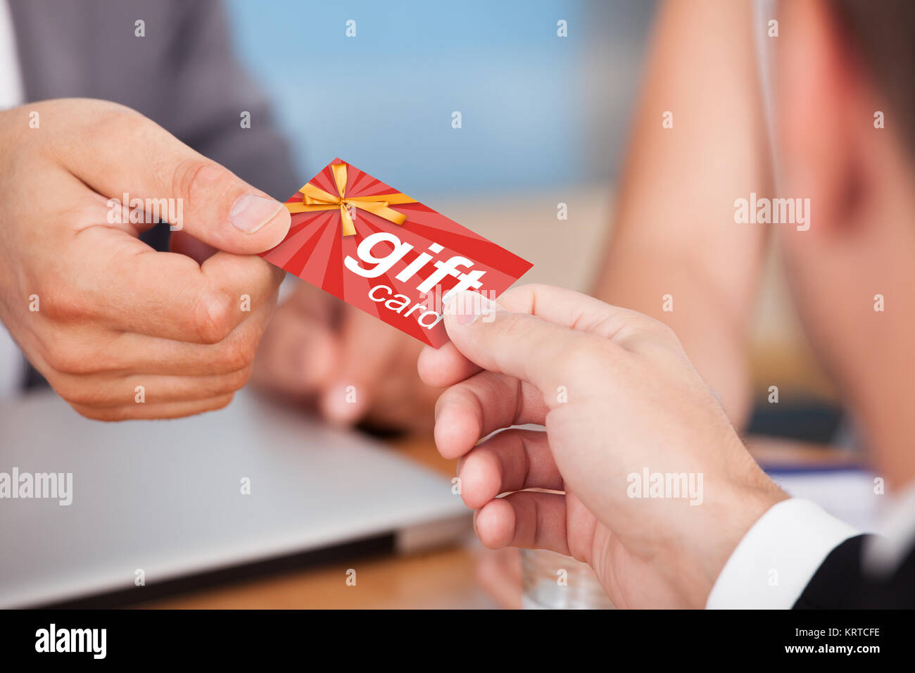 Businessman Giving Card Stock Photo - Alamy