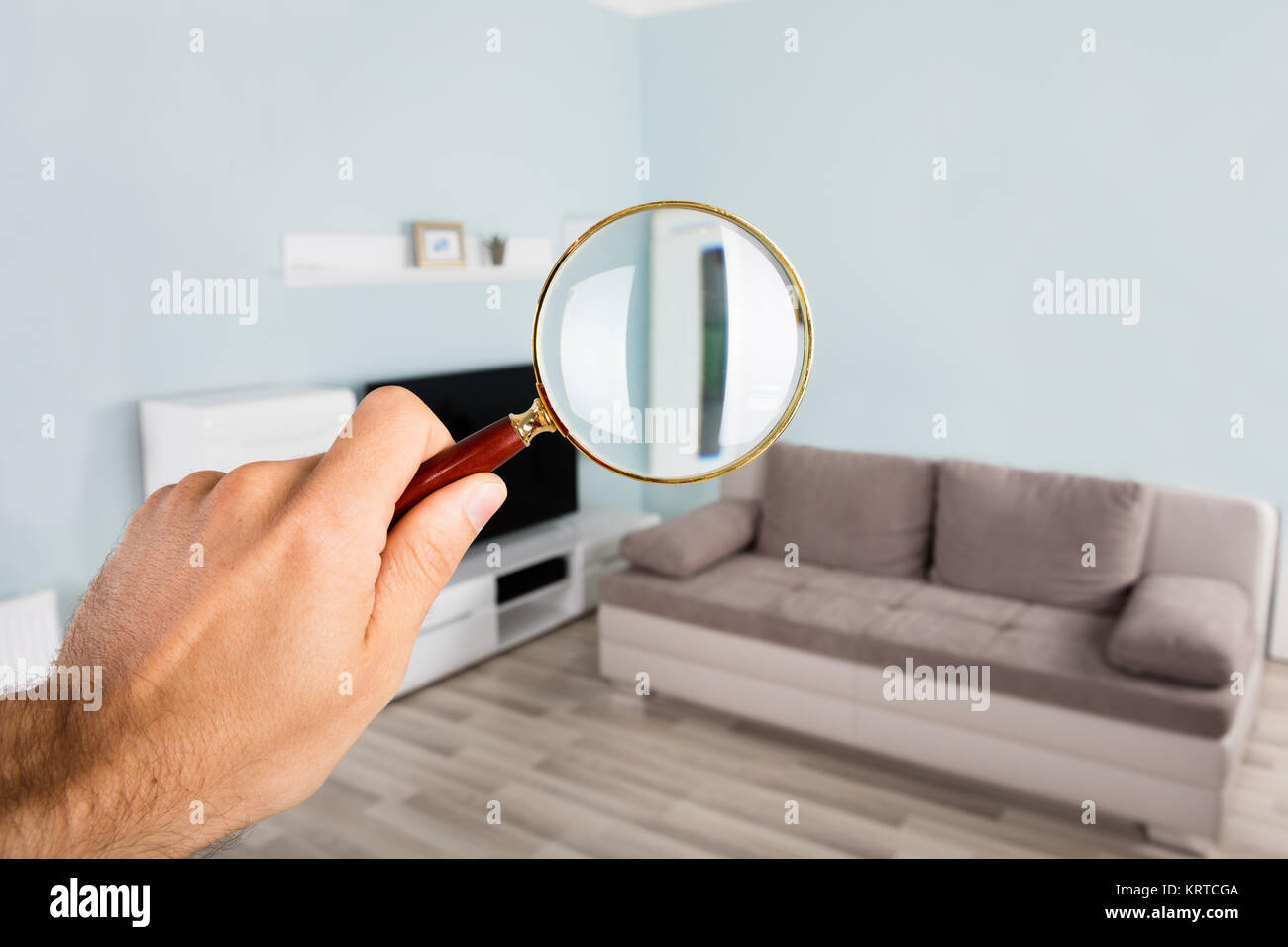 Person Checking Living Room Using Magnifying Glass Stock Photo - Alamy