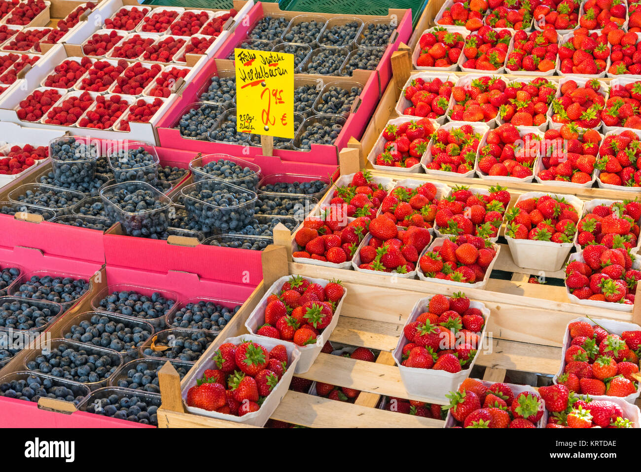 Strawberries,blueberries and raspberries at a market Stock Photo - Alamy