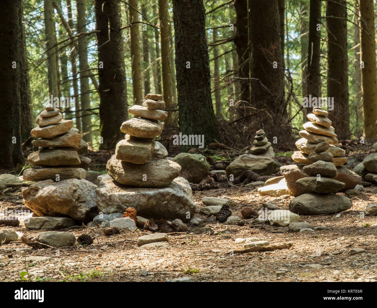 group of cairns (colloquially cairns) on a mountain hiking trail in ...