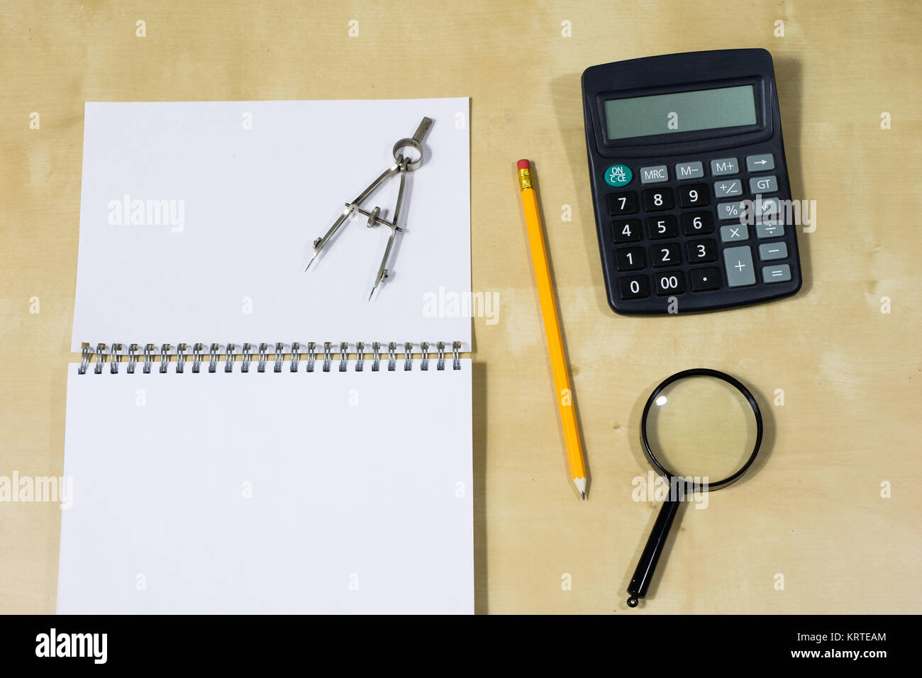Drawing instruments and a notebook on the work table. Accessories for ...