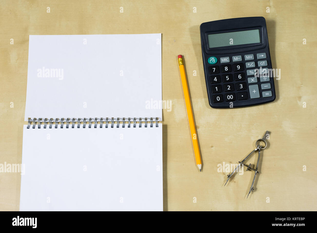 Drawing instruments and a notebook on the work table. Accessories for ...