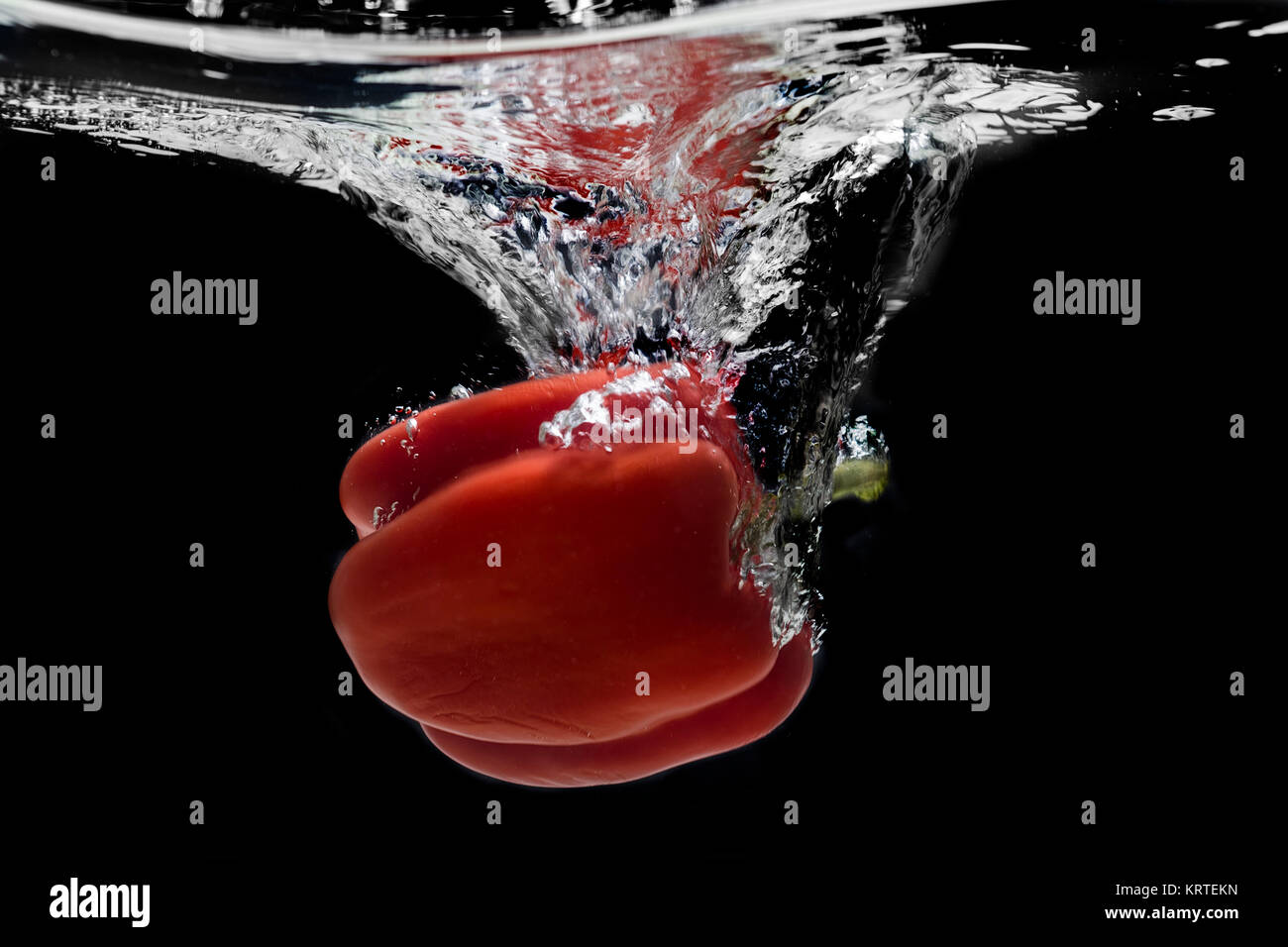Red pepper, water splash Stock Photo - Alamy