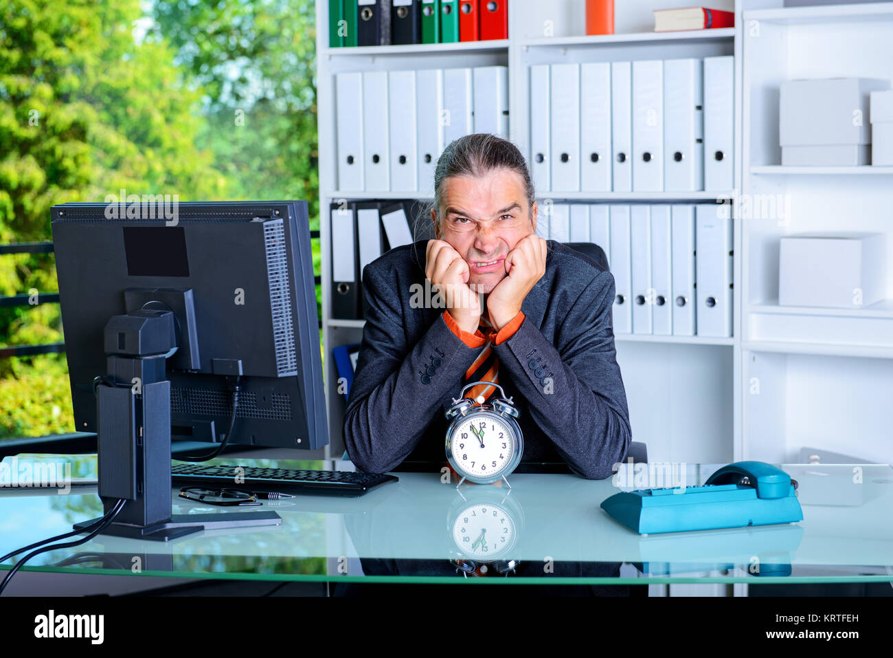 sad business man with clock Stock Photo - Alamy
