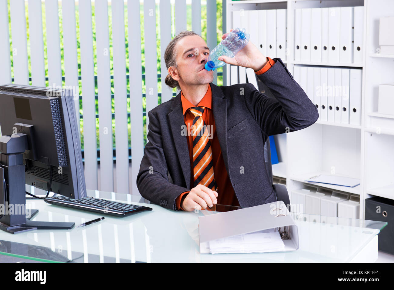 young business man drinking water Stock Photo - Alamy