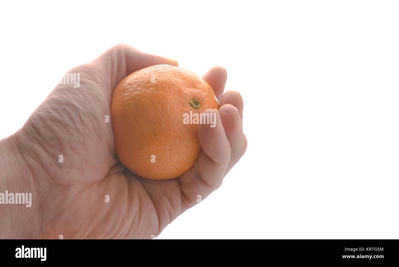 Hand holds a mandarin, isolated on white Stock Photo - Alamy