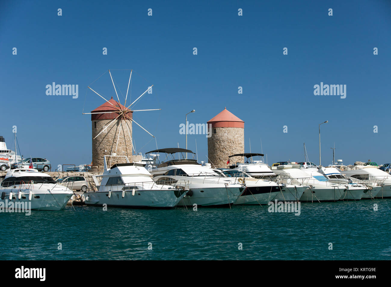 Medieval windmills at Mandraki Harbour in the Dodecanese island of ...