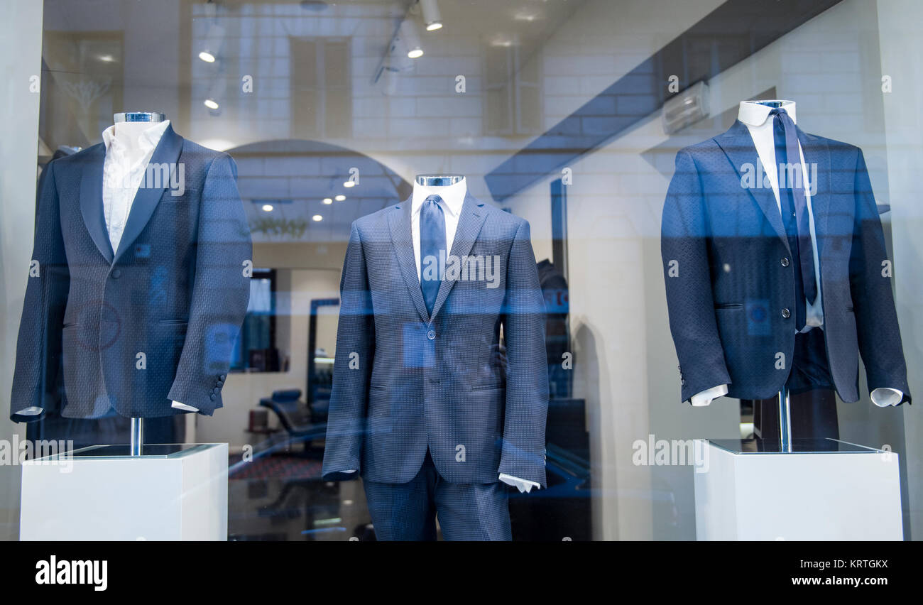 Men suits in a luxury clothing store Stock Photo - Alamy